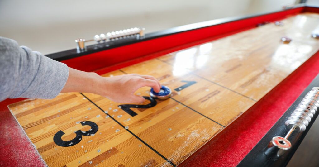 Designing a Game Room Around a Shuffleboard Table | Atlantic Spas ...